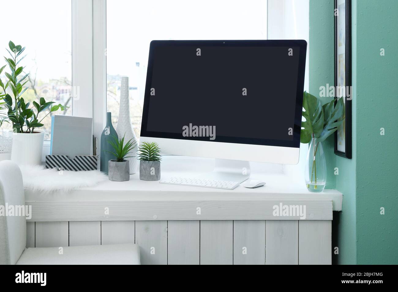 Modern comfortable workplace with computer on window sill at home Stock ...