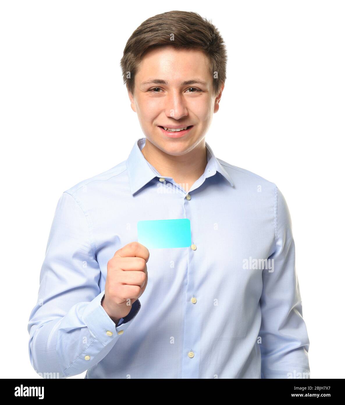 Cute teenage boy with card on white background Stock Photo - Alamy