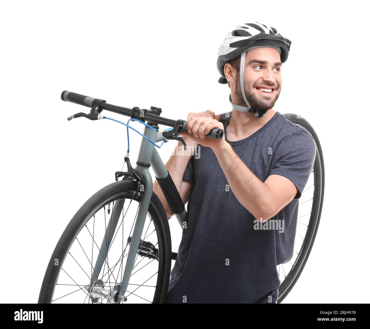 Handsome young man with bicycle on white background Stock Photo - Alamy