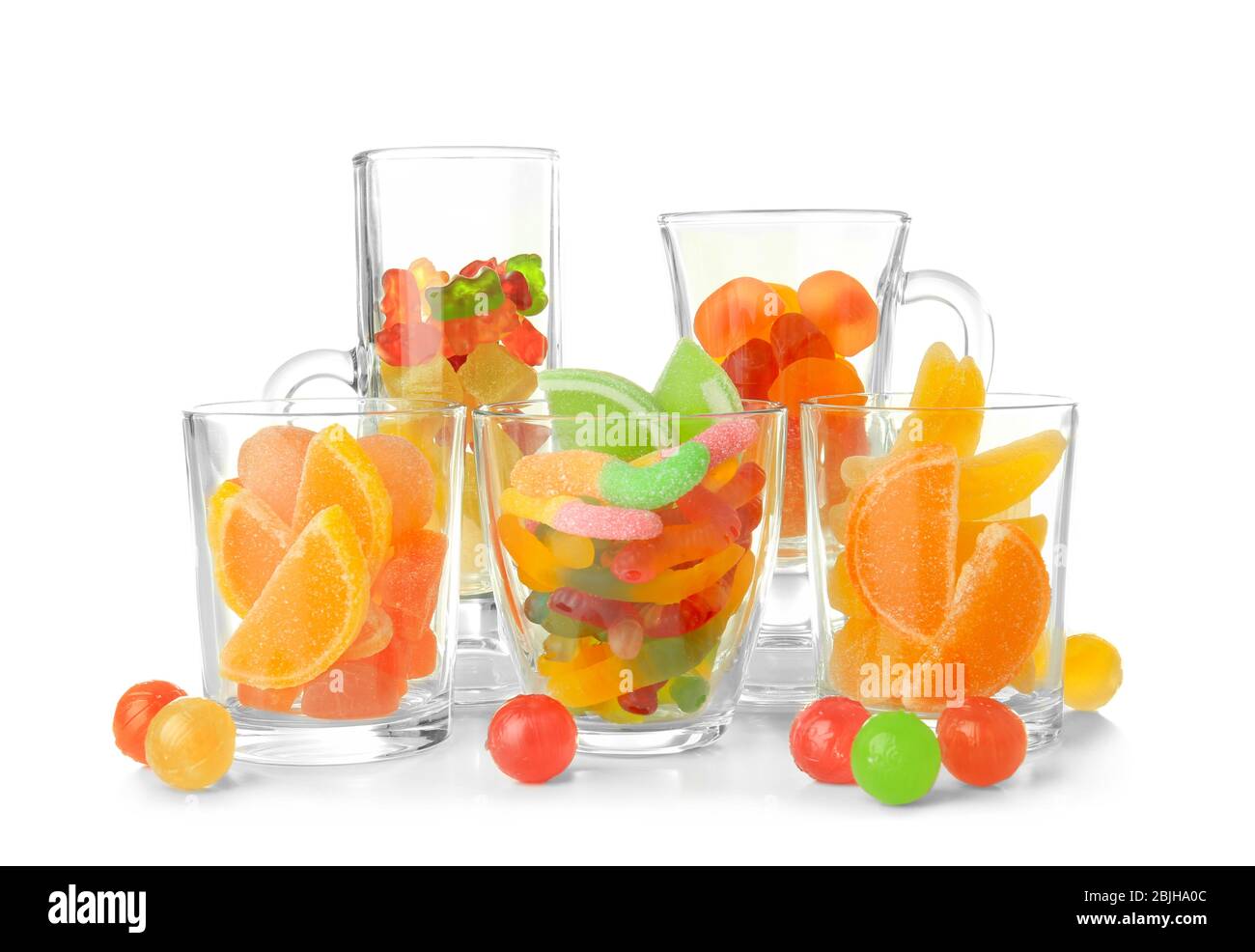 Colorful candies in glasses on white background Stock Photo - Alamy
