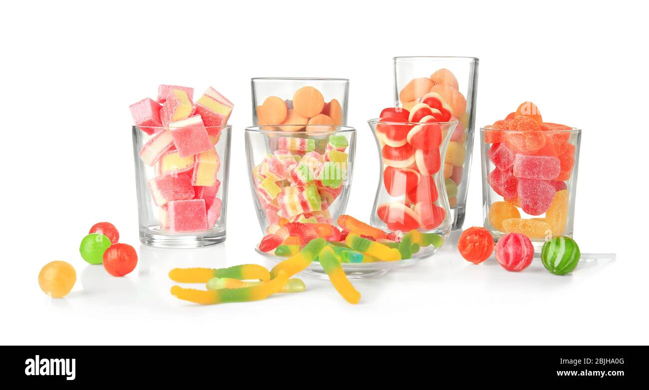 Colorful candies in glasses on white background Stock Photo - Alamy