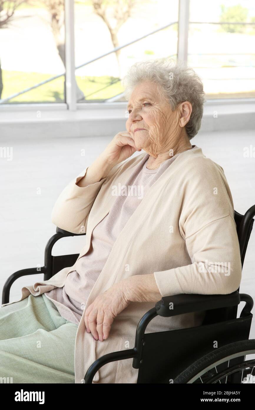 Disabled elderly woman in wheelchair at home Stock Photo - Alamy