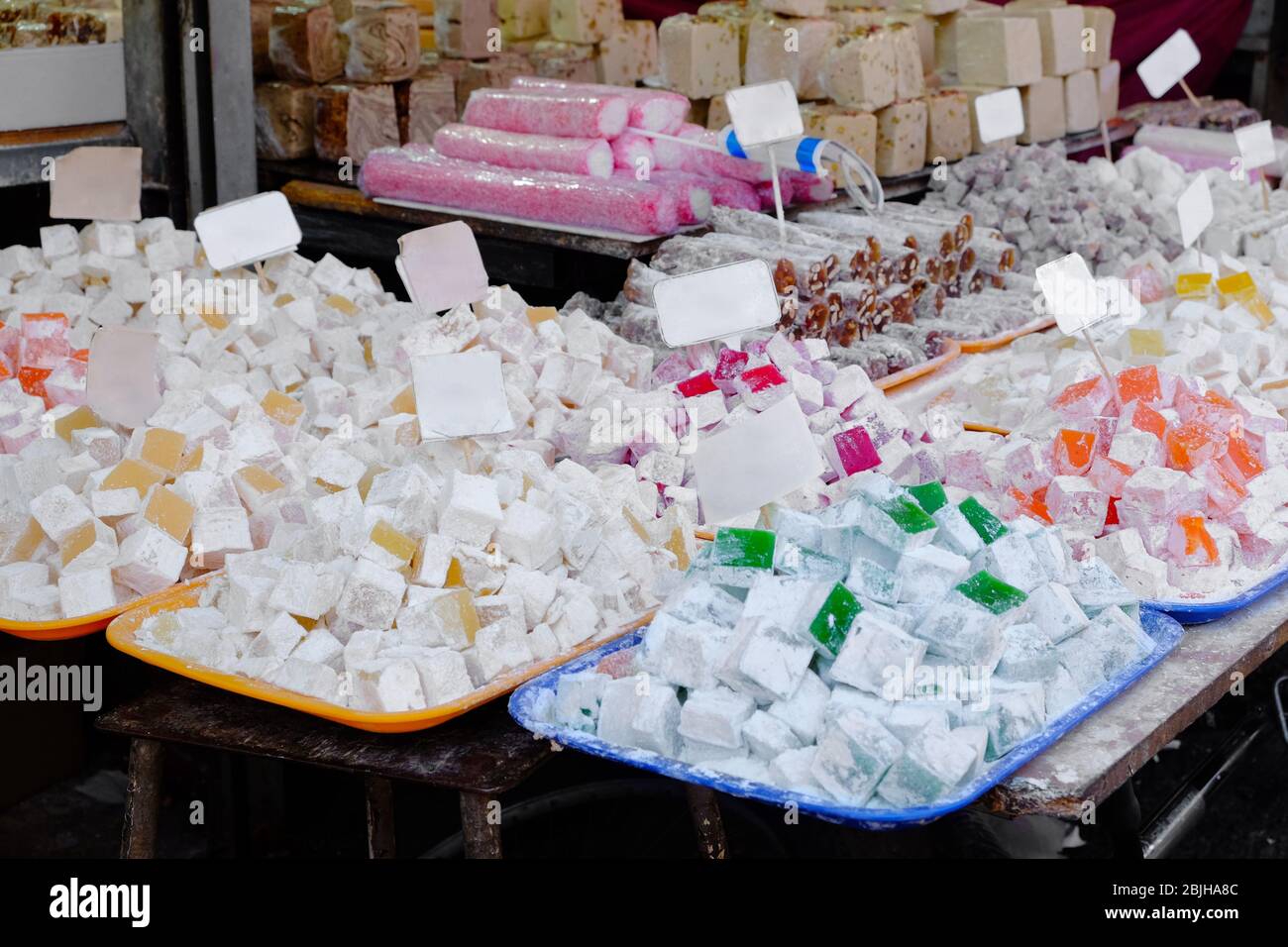 Different tasty Turkish delight at market Stock Photo - Alamy