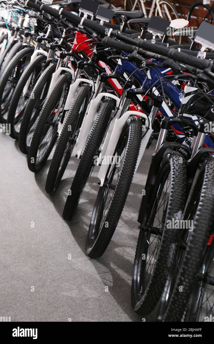 Row of new bicycles in shop Stock Photo - Alamy