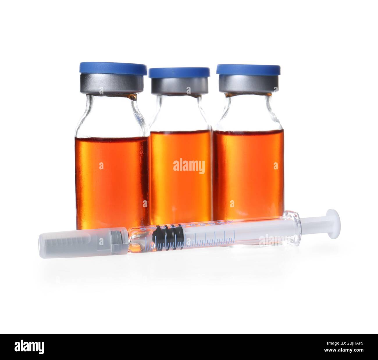 Ampules with vaccine and syringe on white background Stock Photo - Alamy