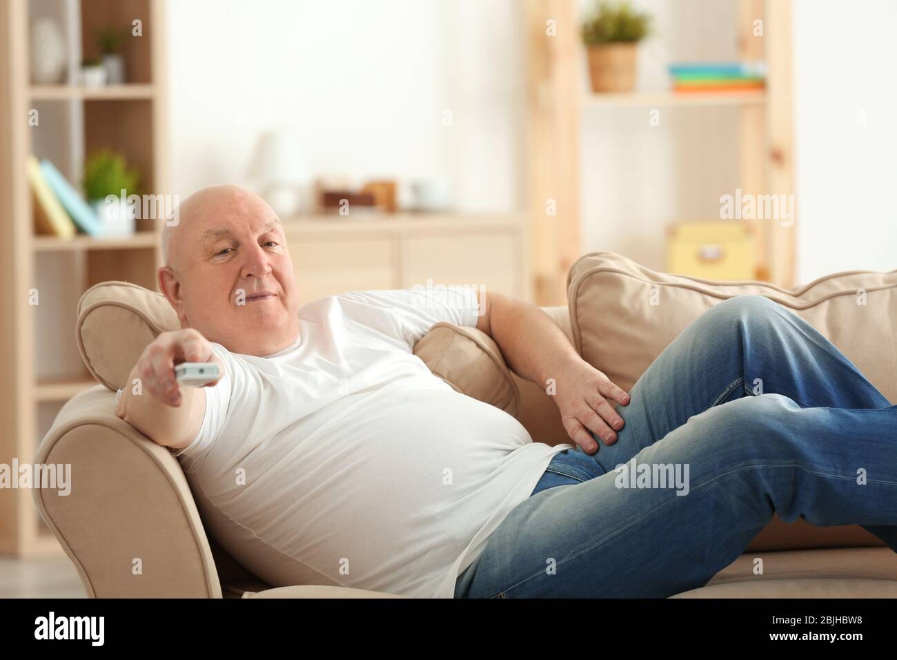 Senior man watching television hi-res stock photography and images - Alamy