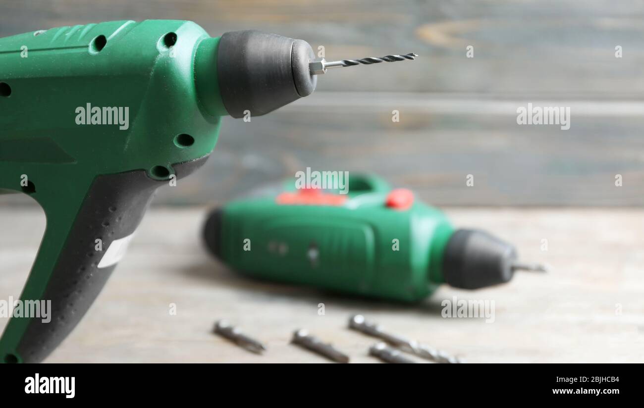 Modern drill on blurred background Stock Photo - Alamy