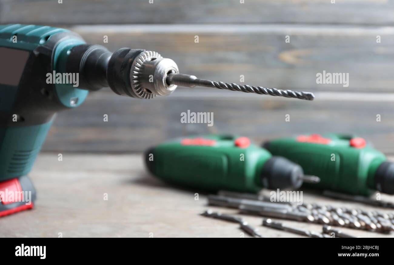 Modern drill on blurred background Stock Photo - Alamy