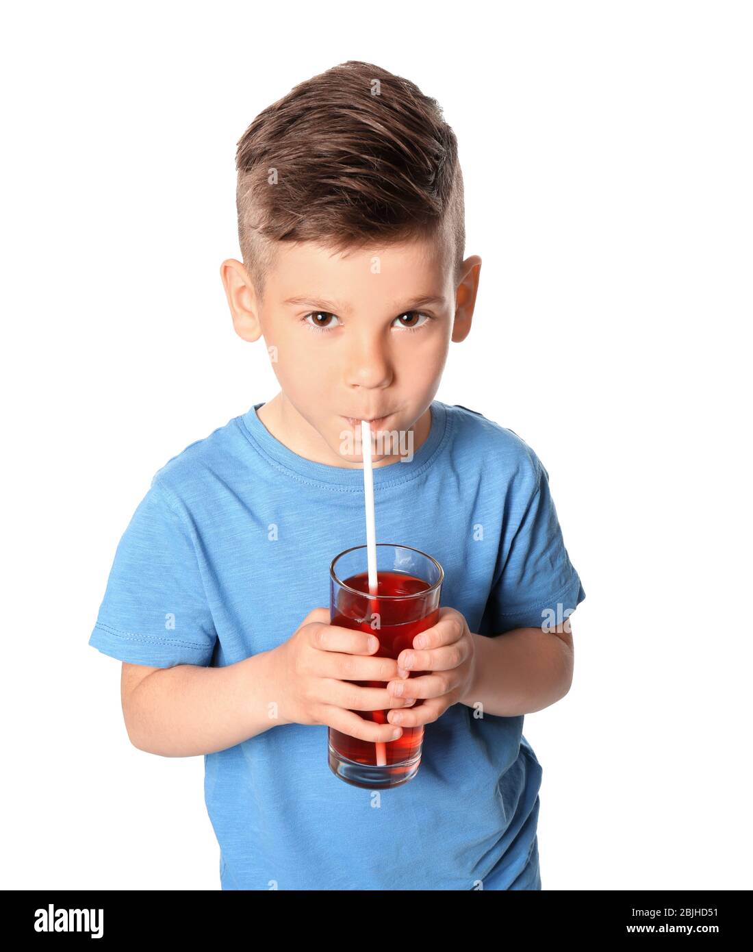 Cute little boy drinking juice on white background Stock Photo - Alamy