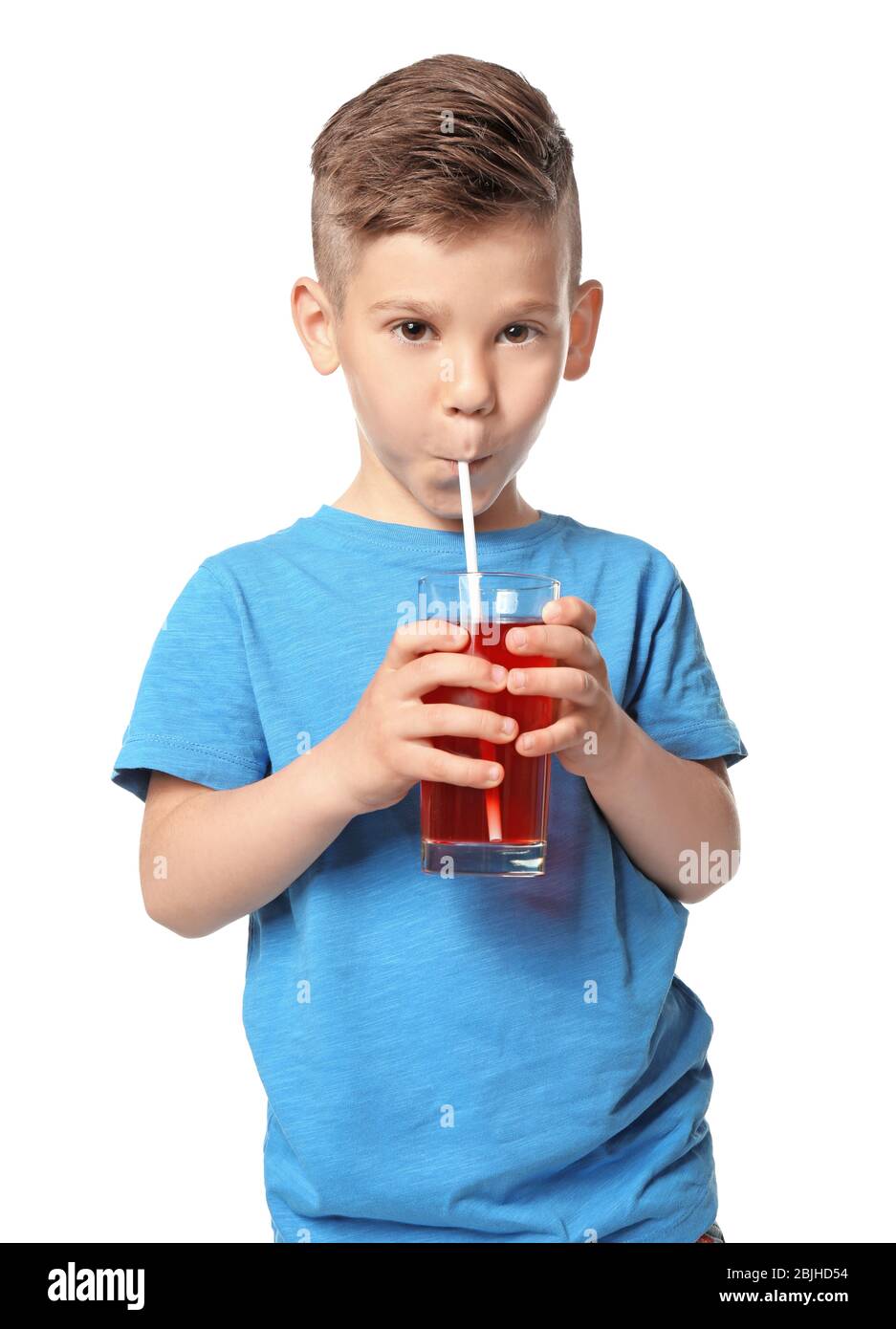 Cute little boy drinking juice on white background Stock Photo - Alamy