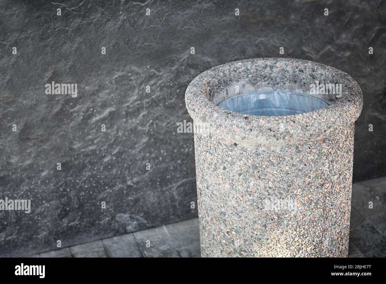 Stone bin on street Stock Photo - Alamy