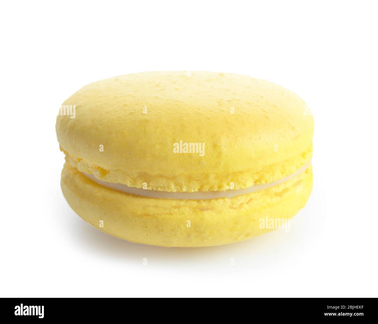 Lemon macaron on white background Stock Photo - Alamy
