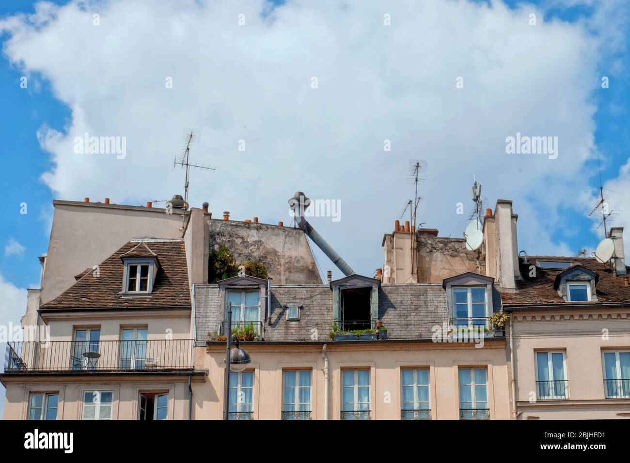 Roof of old building on sky background Stock Photo - Alamy