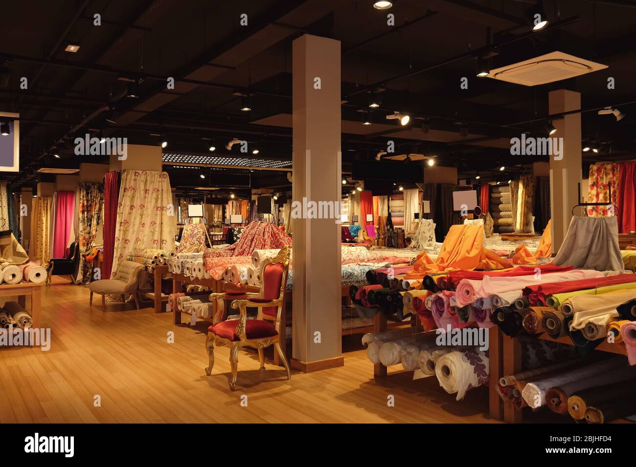 Large assortment of textiles in fabric shop Stock Photo - Alamy