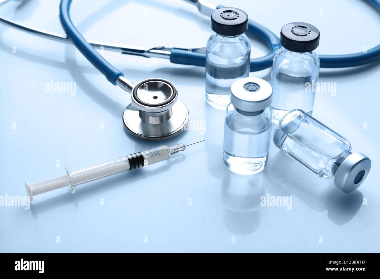 Medical supplies on light background. Vaccination concept Stock Photo ...