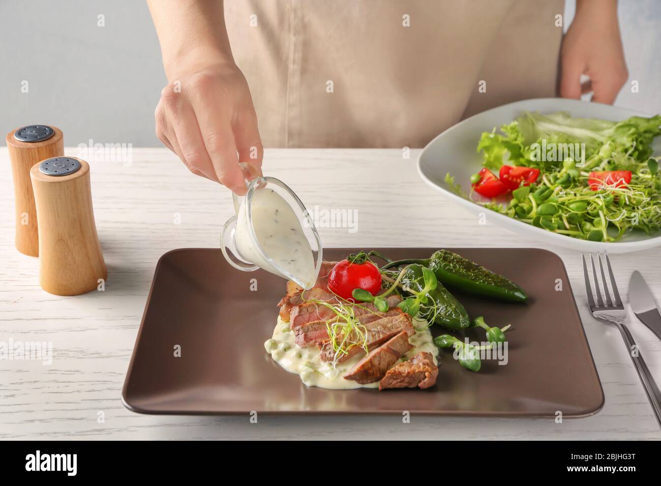 Chef hands applying tomato sauce hi-res stock photography and images ...