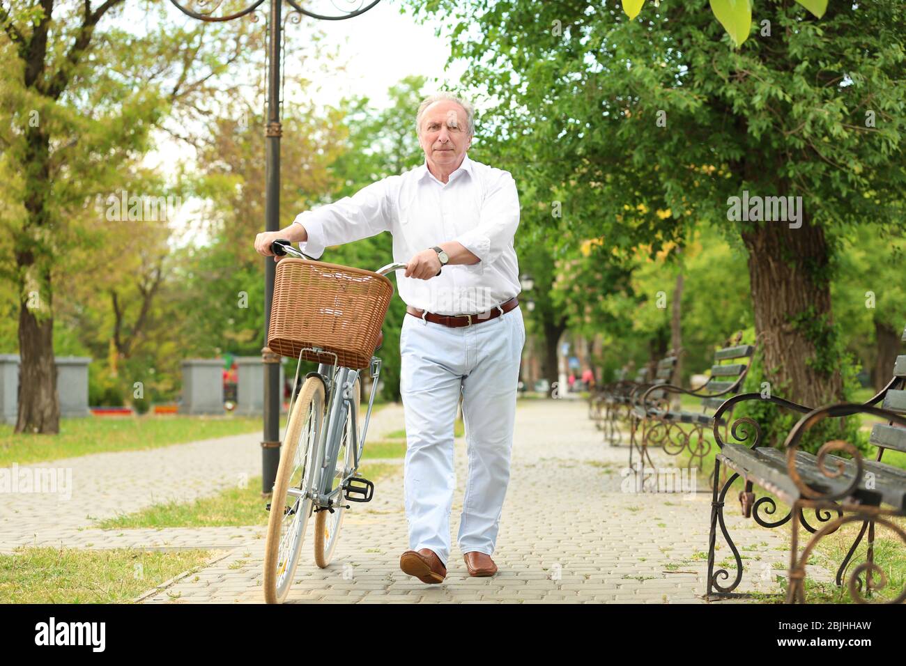 Handsome senior man bicycle hi-res stock photography and images - Alamy