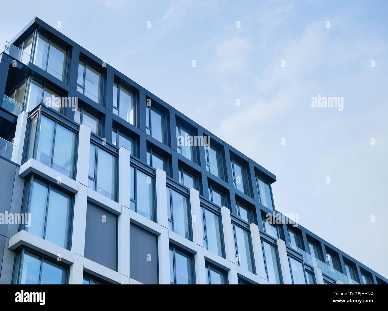 Modern office building with window screens Stock Photo - Alamy