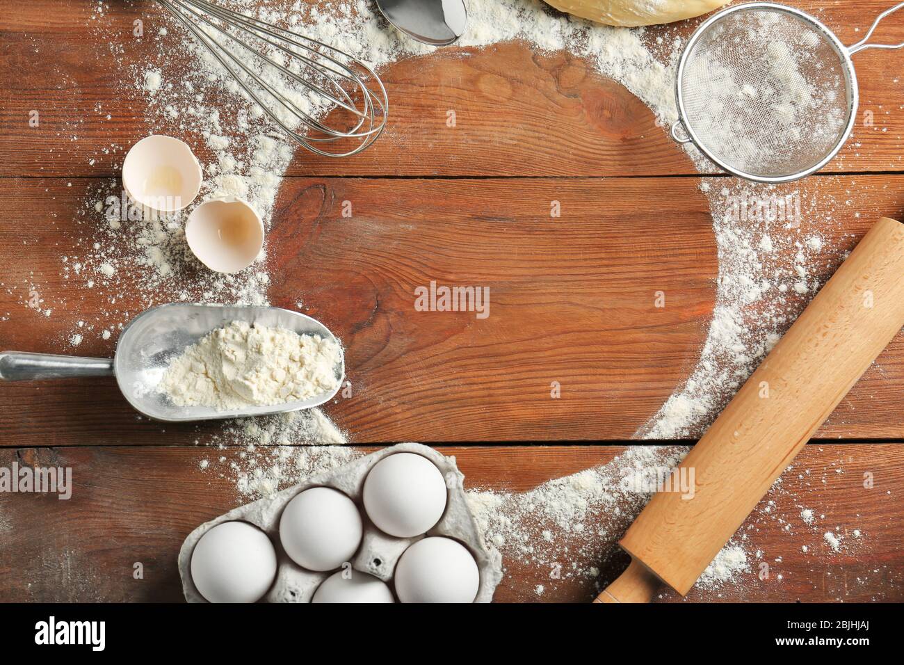 Frame made of flour and ingredients on kitchen table. Cooking classes ...