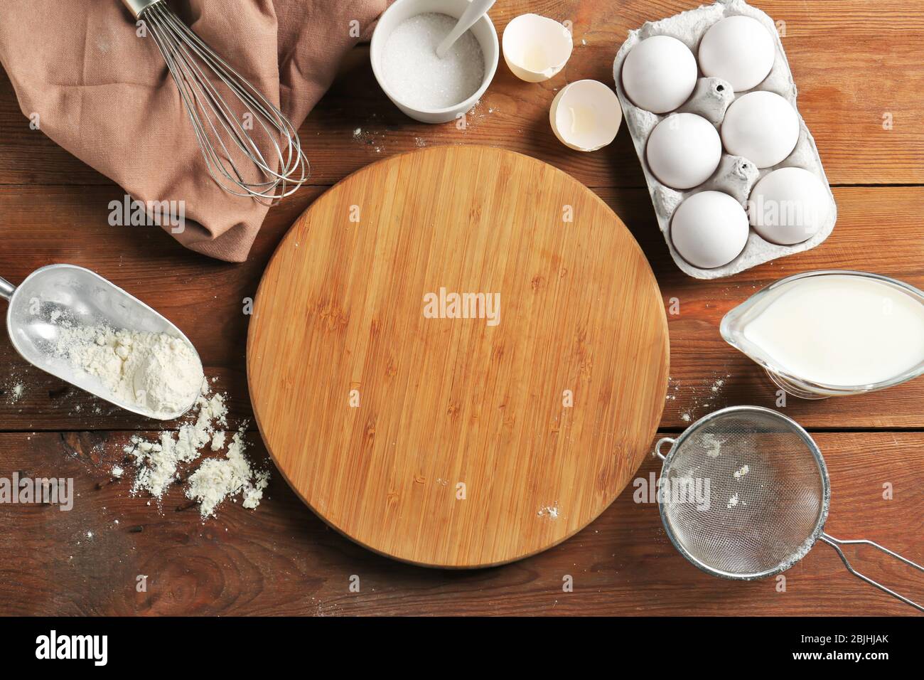 Wooden board and ingredients on kitchen table. Cooking classes concept ...