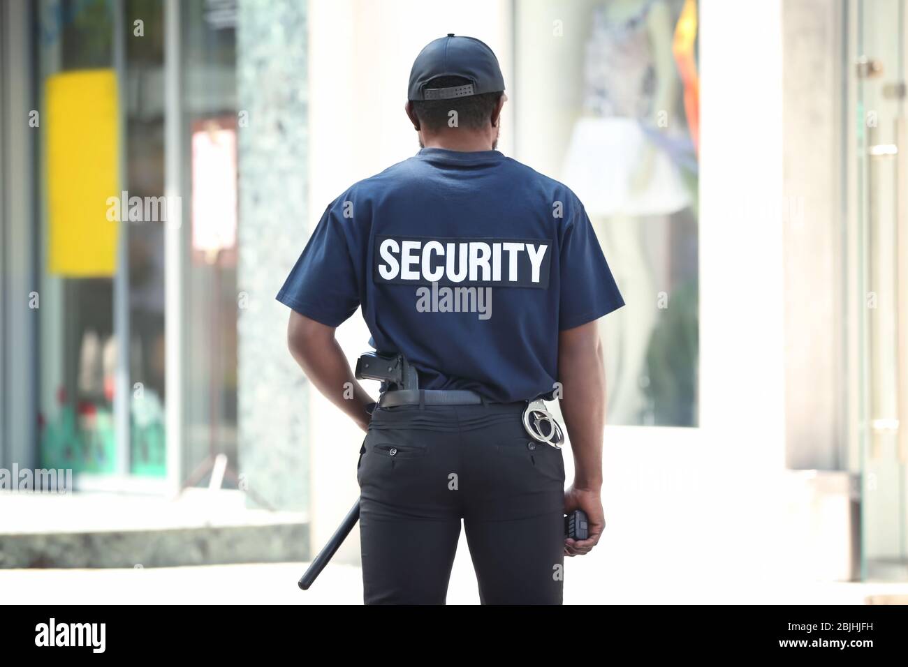 Male security guard outdoors Stock Photo - Alamy