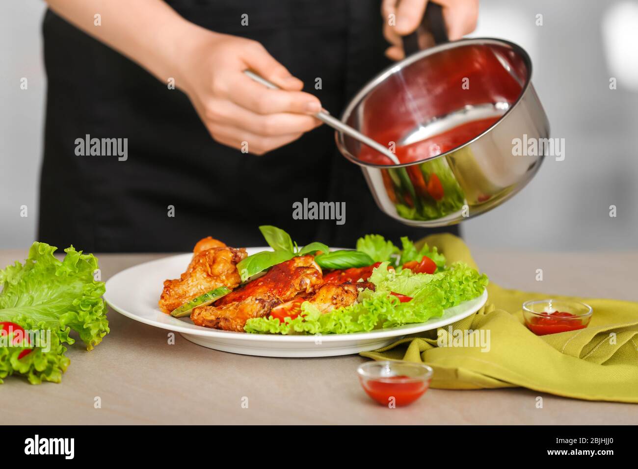 Spoon pouring sauce meat dish hi-res stock photography and images - Alamy