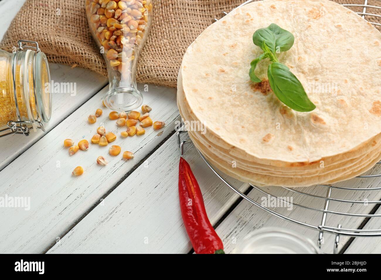 Cooling rack with delicious tortillas on kitchen table Stock Photo - Alamy