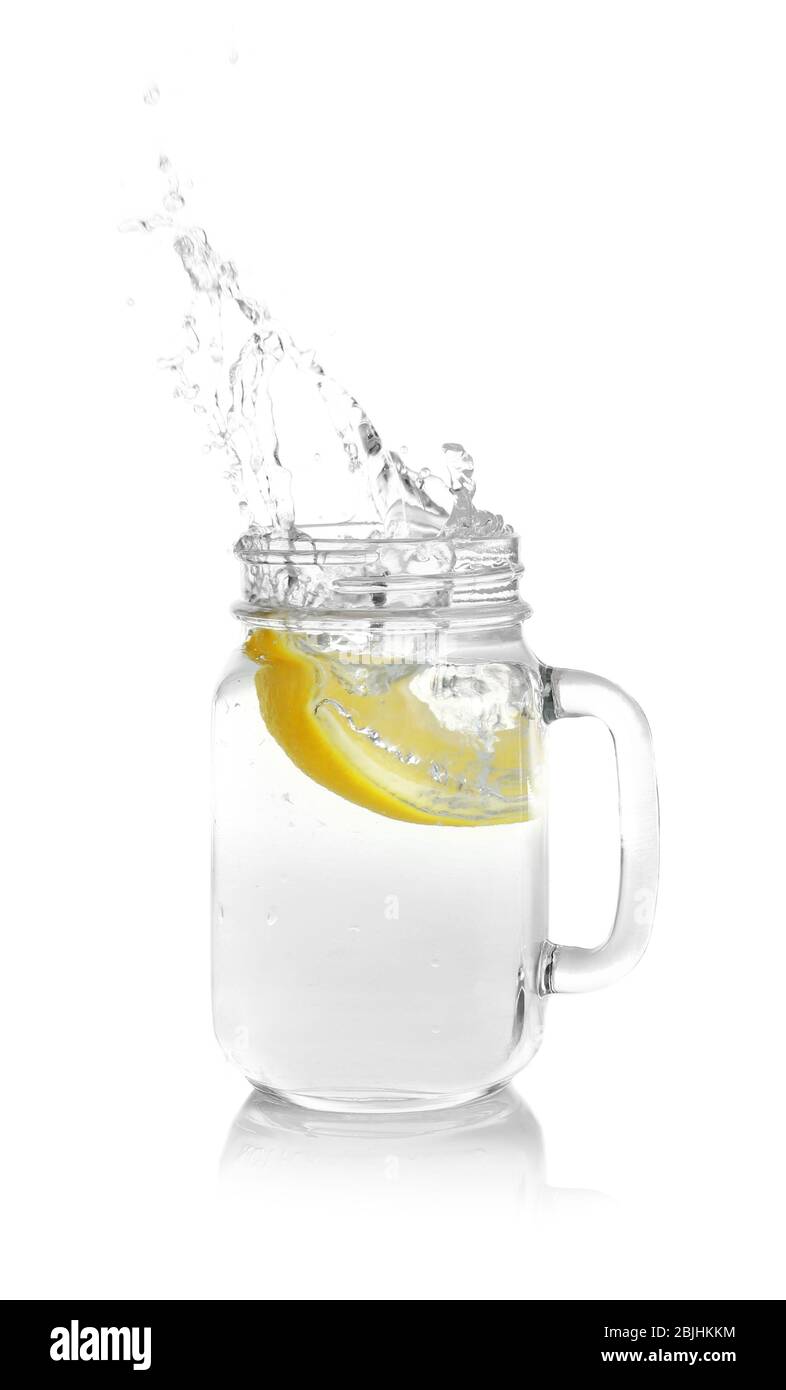 Mason jar of lemonade with splashing water on white background Stock ...