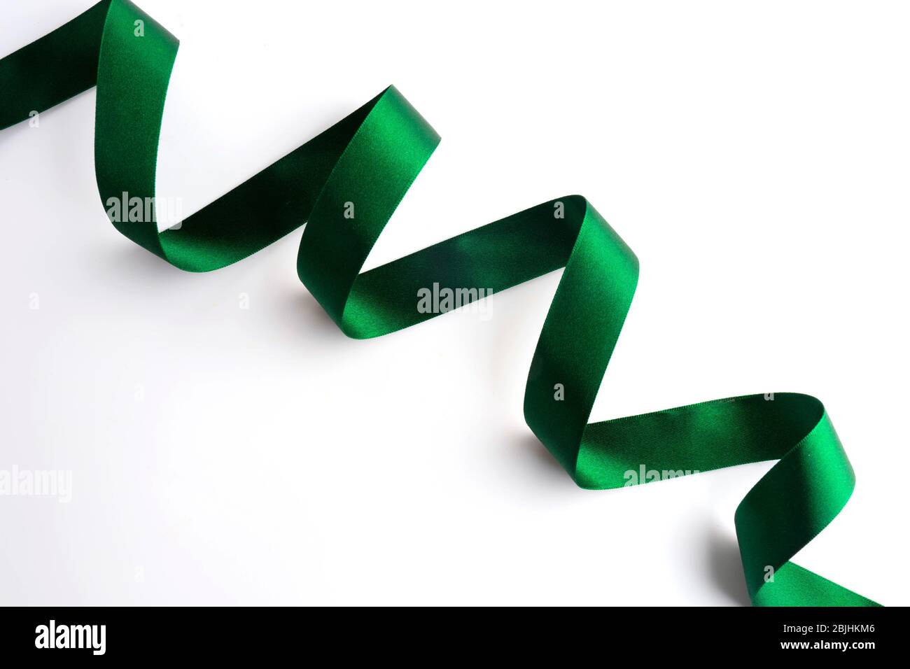Green bow ribbon satin texture isolated on white background Stock Photo ...