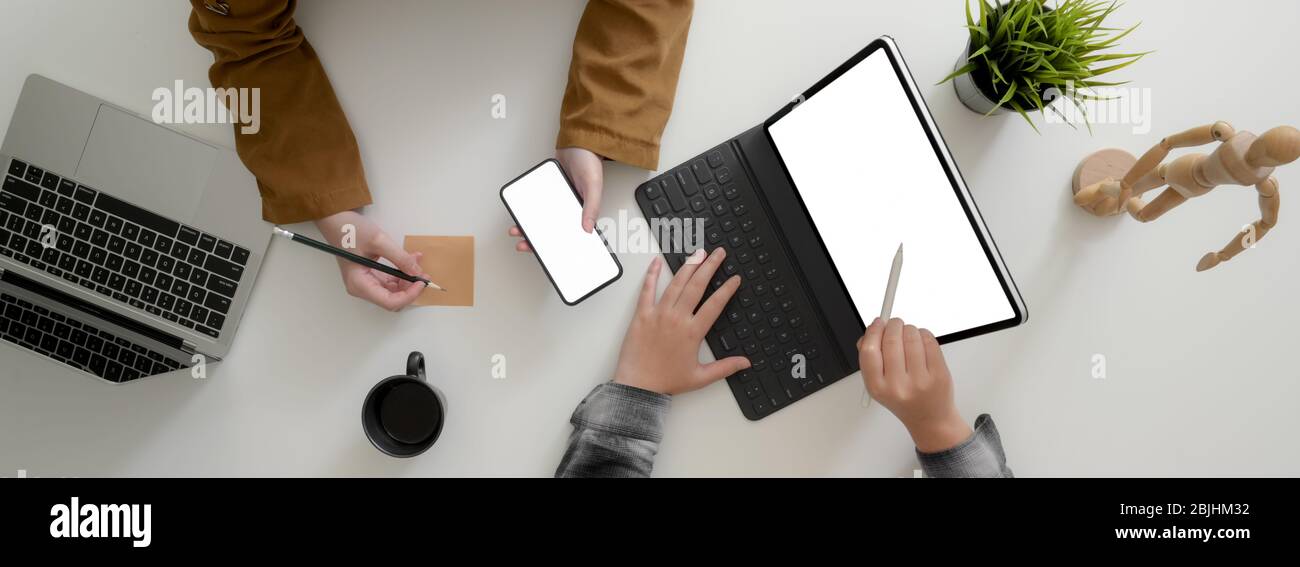 Overhead shot of businesspeople analysing on their strategy with blank ...