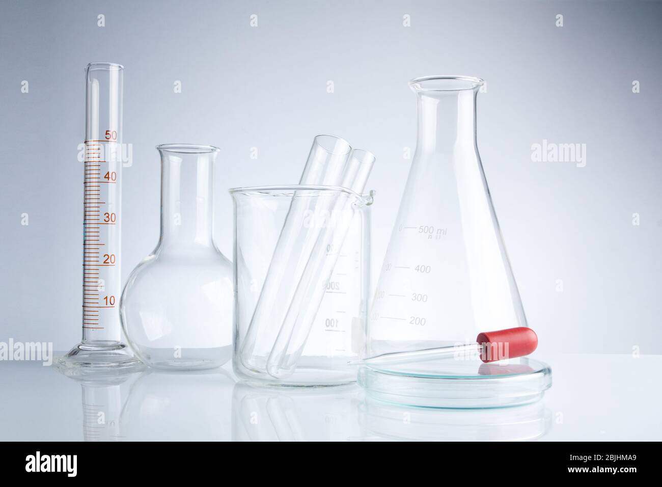 Group of laboratory glassware on table, Symbolic of science research ...
