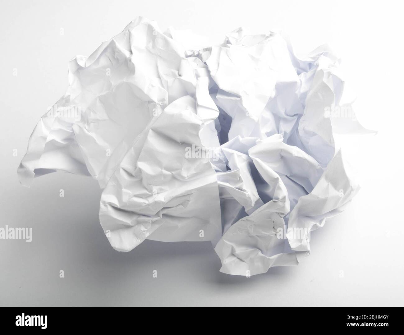 single page of crumpled paper on white background Stock Photo - Alamy