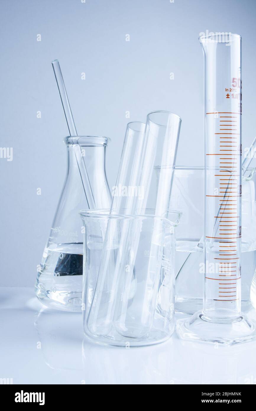 Group of laboratory glassware on table, Symbolic of science research ...