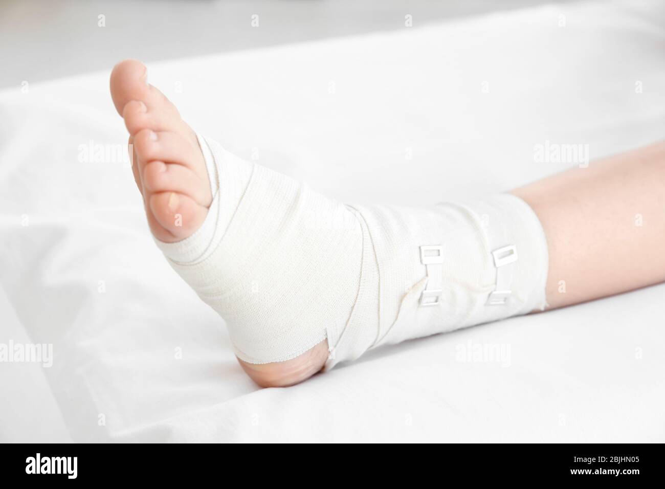Young woman with bandaged leg in clinic, closeup Stock Photo - Alamy