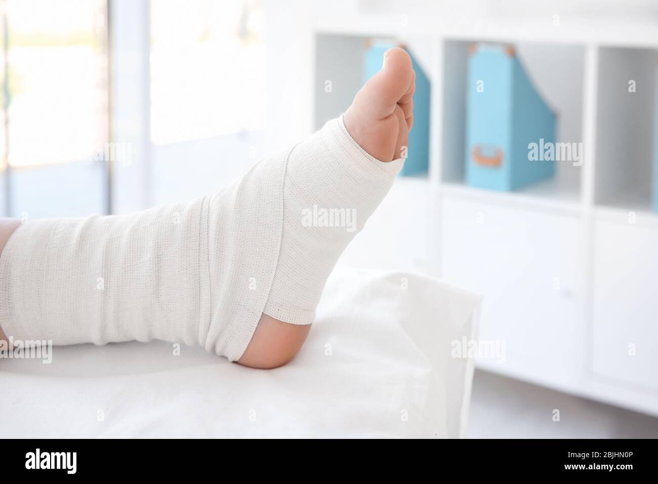 Young woman with bandaged leg in clinic, closeup Stock Photo - Alamy