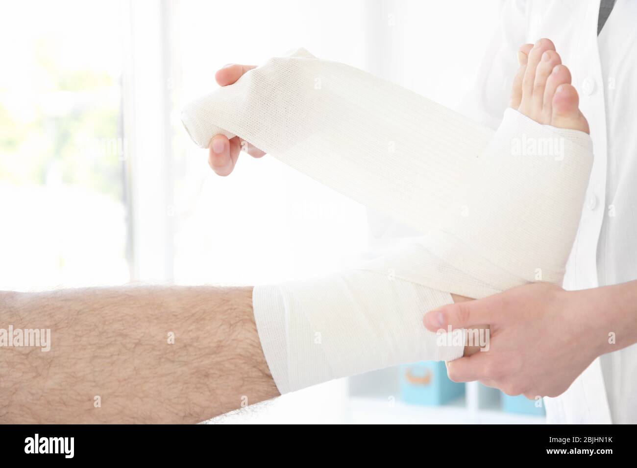 Applying elastic bandage ankle hi-res stock photography and images - Alamy