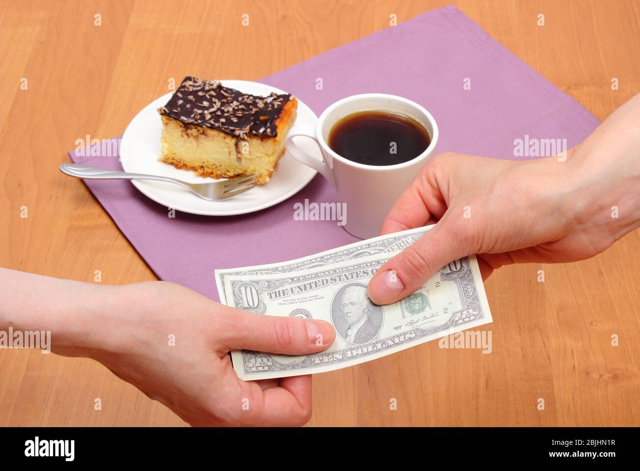 Paying for food in the cafe or restaurant, cheesecake and coffee ...