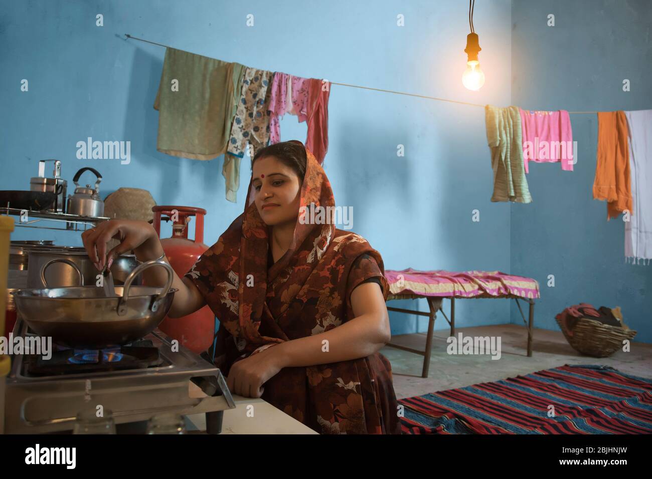 Indian woman cooking gas hi-res stock photography and images - Alamy