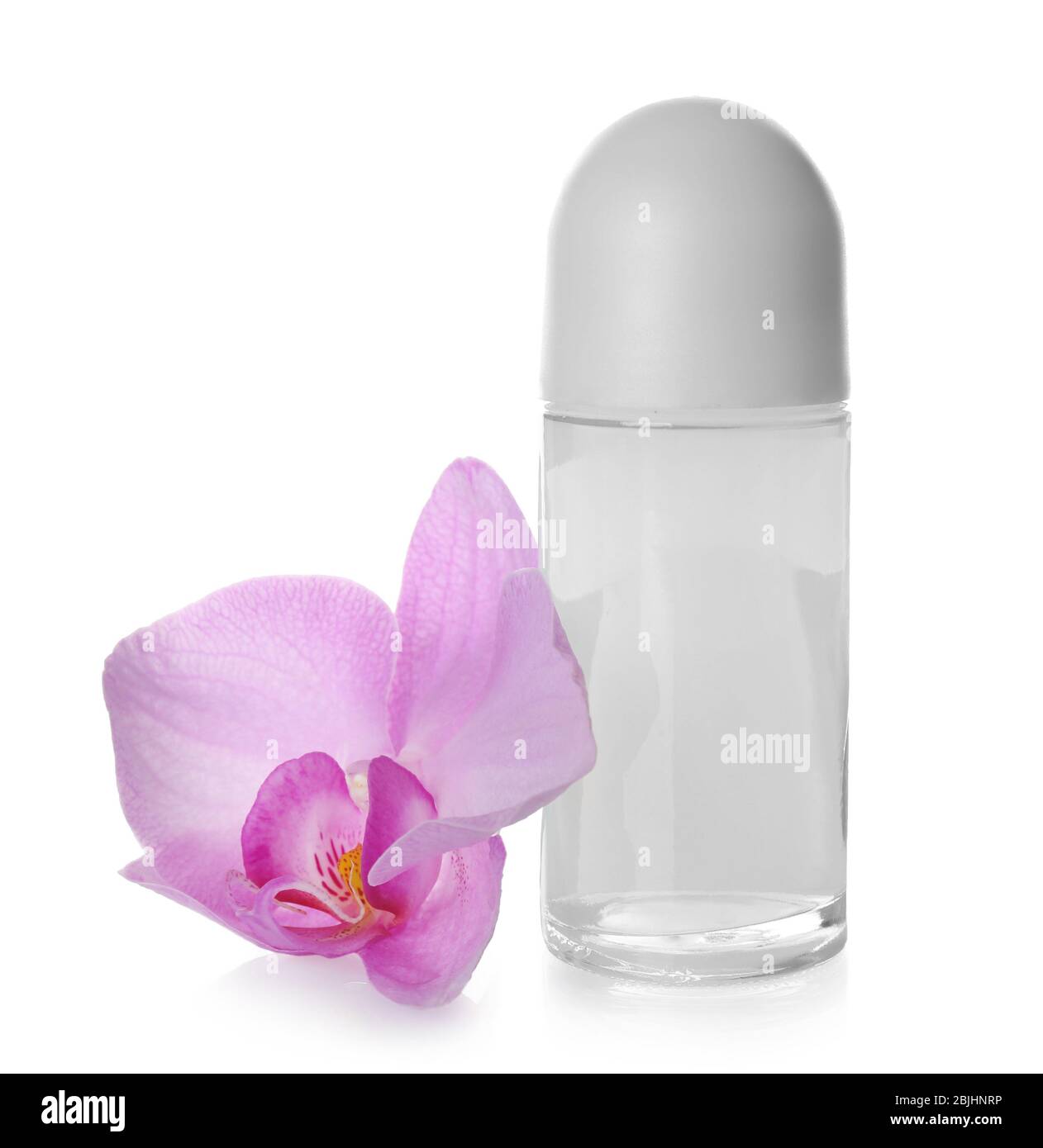 Female deodorant and orchid flower on white background Stock Photo - Alamy