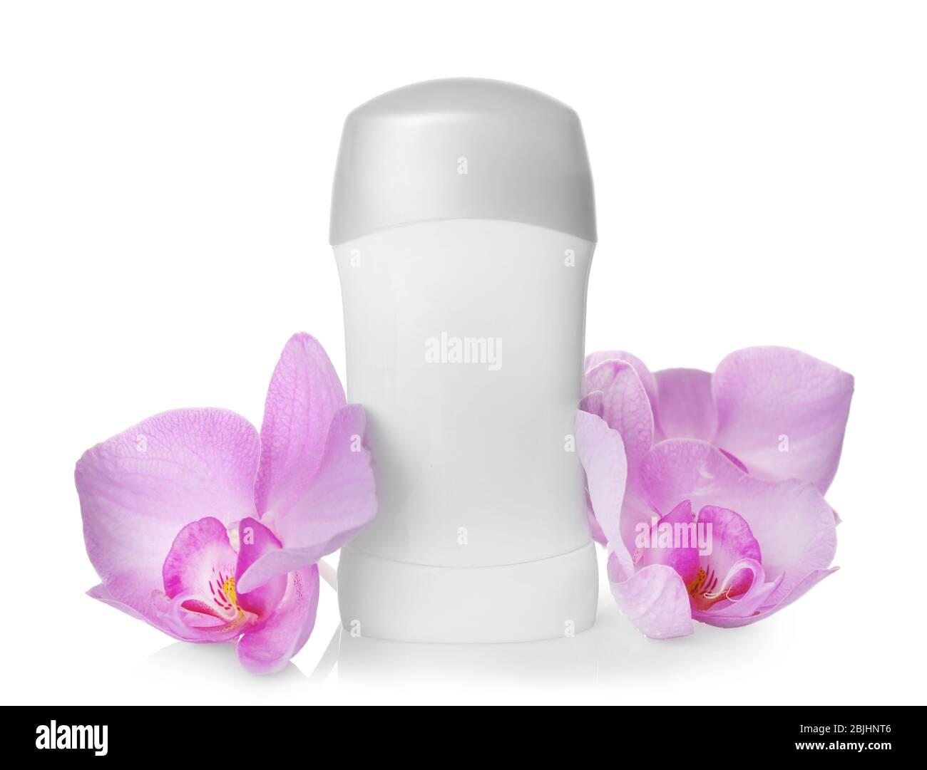 Female deodorant and orchid flowers on white background Stock Photo - Alamy