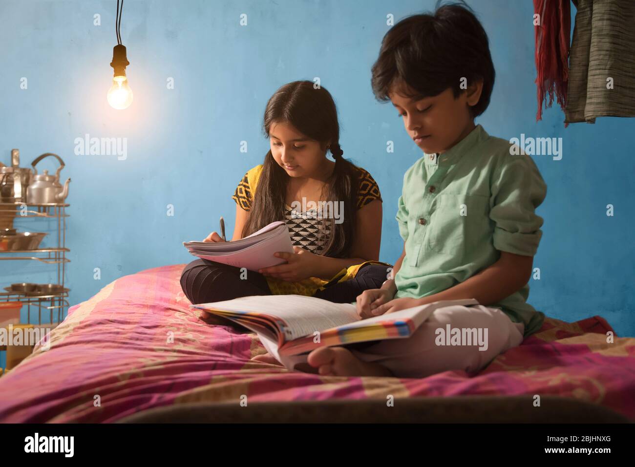Rural kids Studying At Night Stock Photo - Alamy