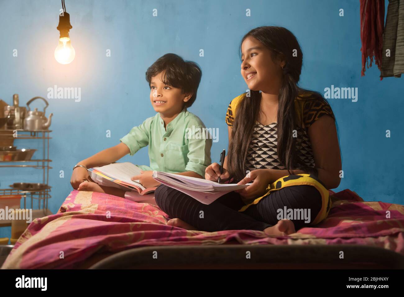 Rural kids Studying At Night Stock Photo - Alamy