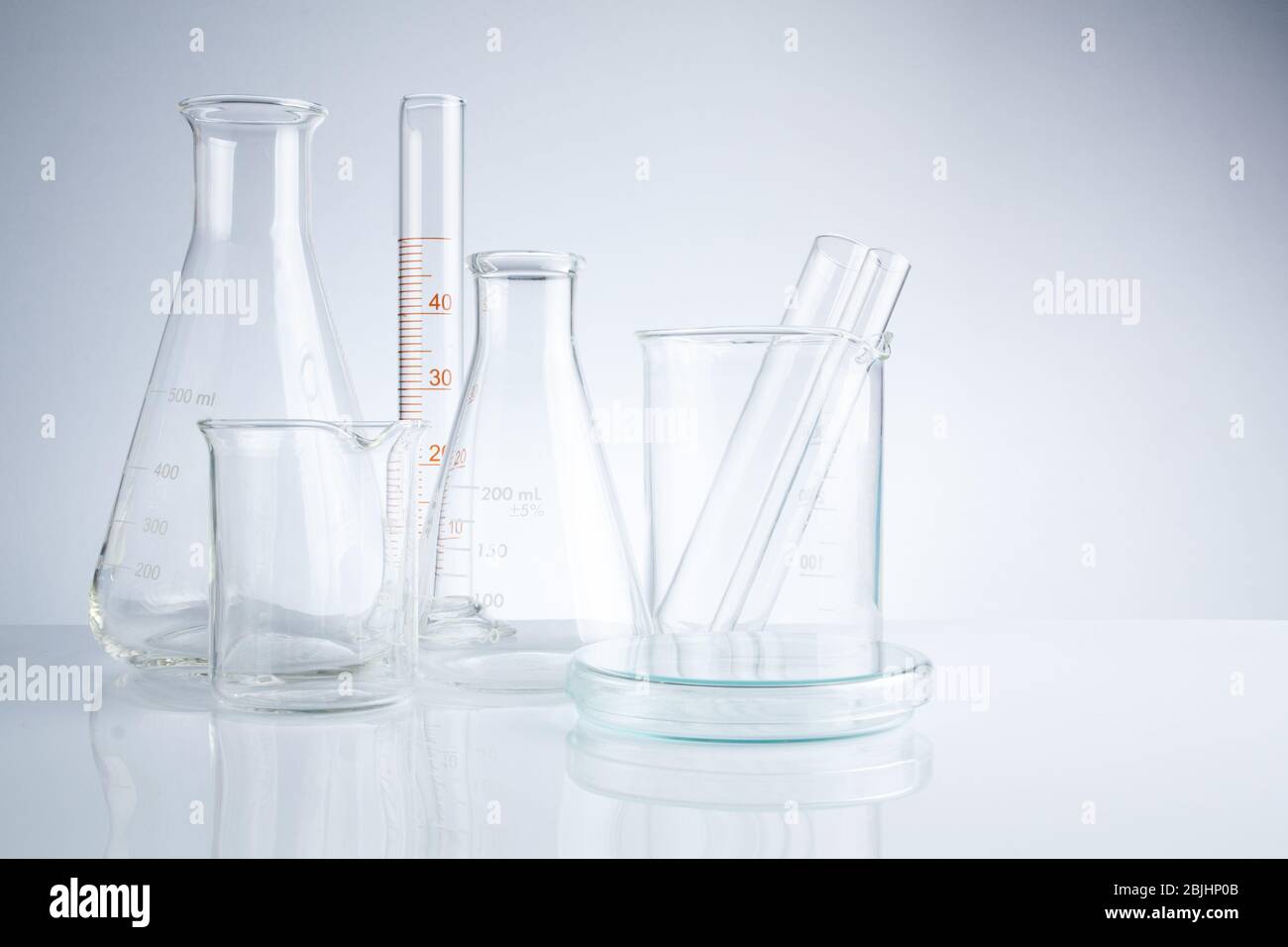Group of laboratory glassware on table, Symbolic of science research ...