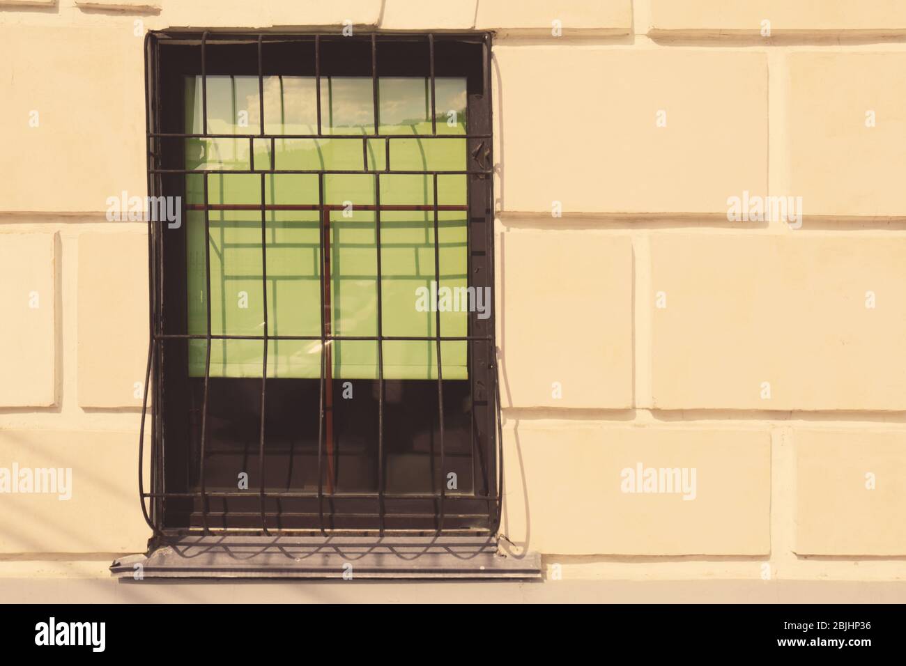 Modern window with metallic lattice Stock Photo - Alamy
