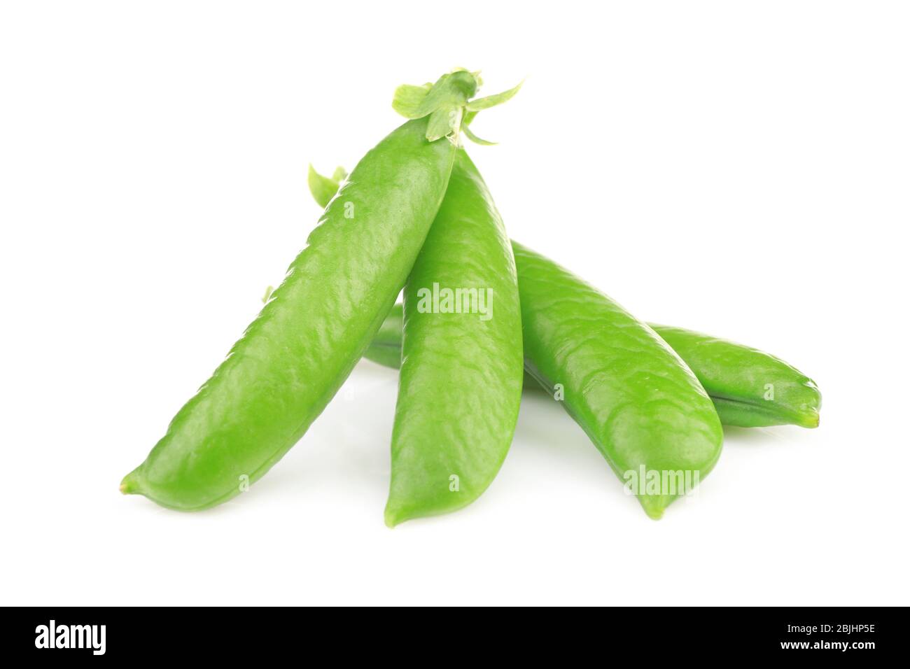 Fresh green peas pods on white background Stock Photo - Alamy