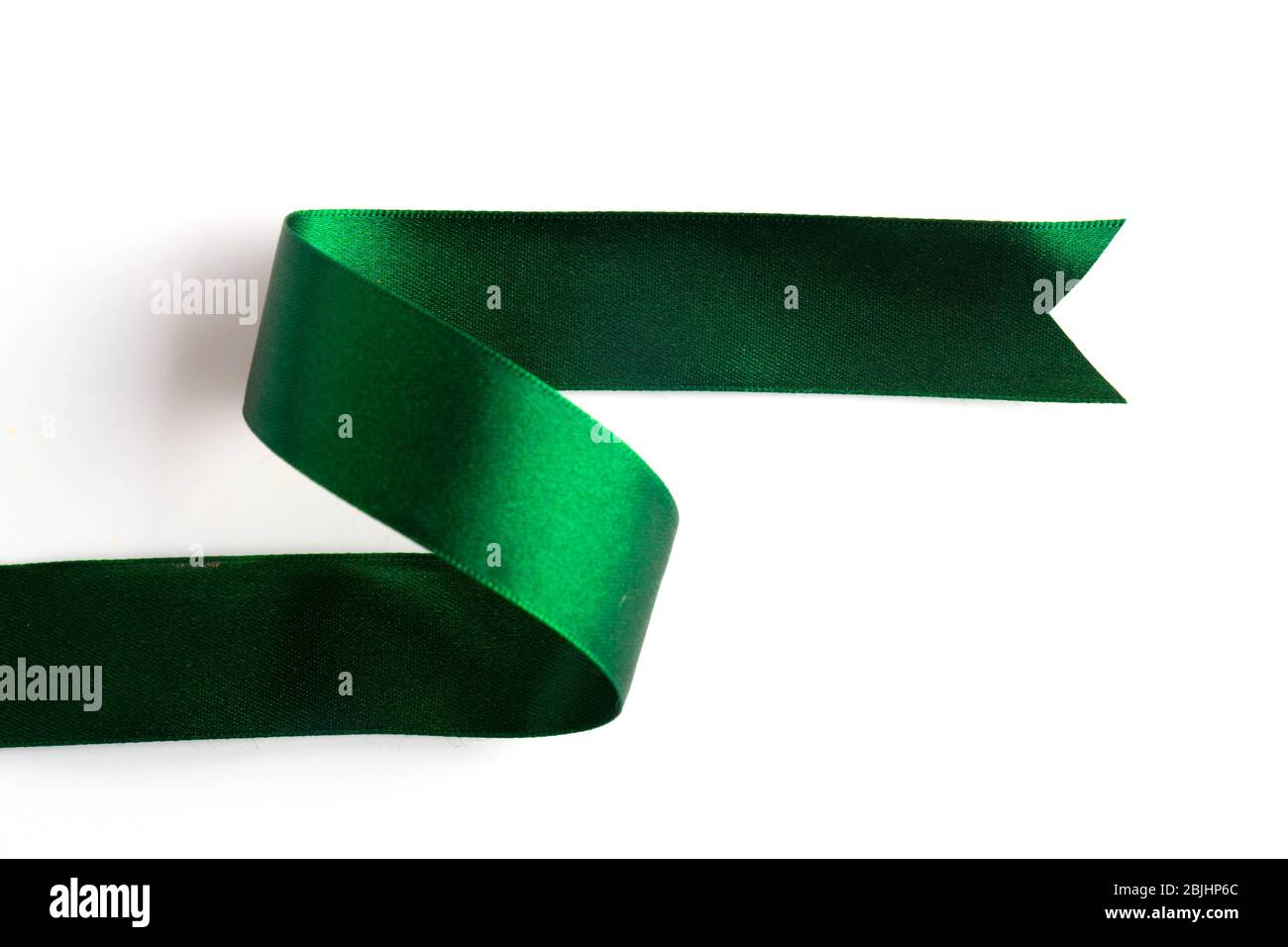 Green bow ribbon satin texture isolated on white background Stock Photo ...