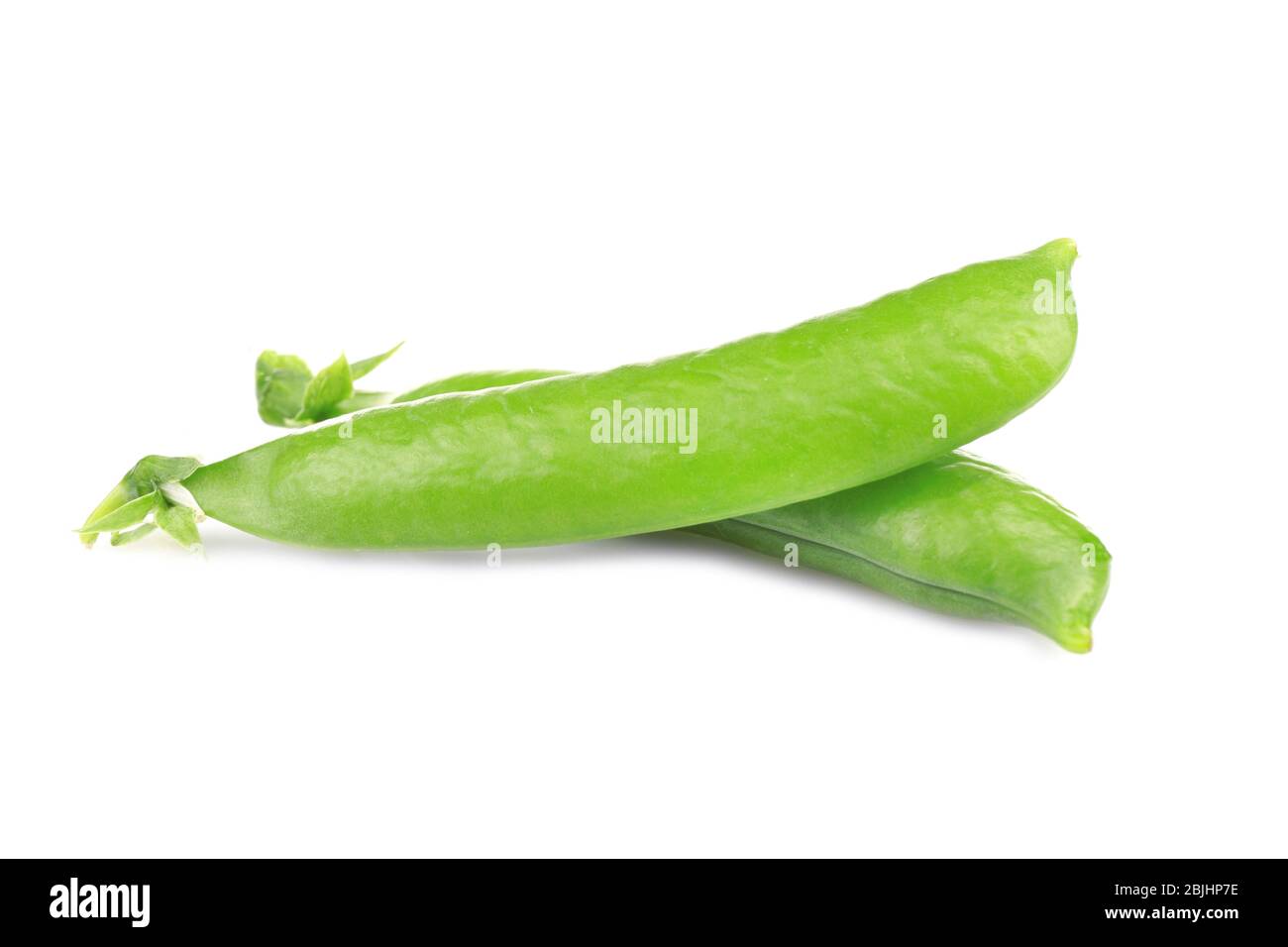 Fresh green peas pods on white background Stock Photo - Alamy