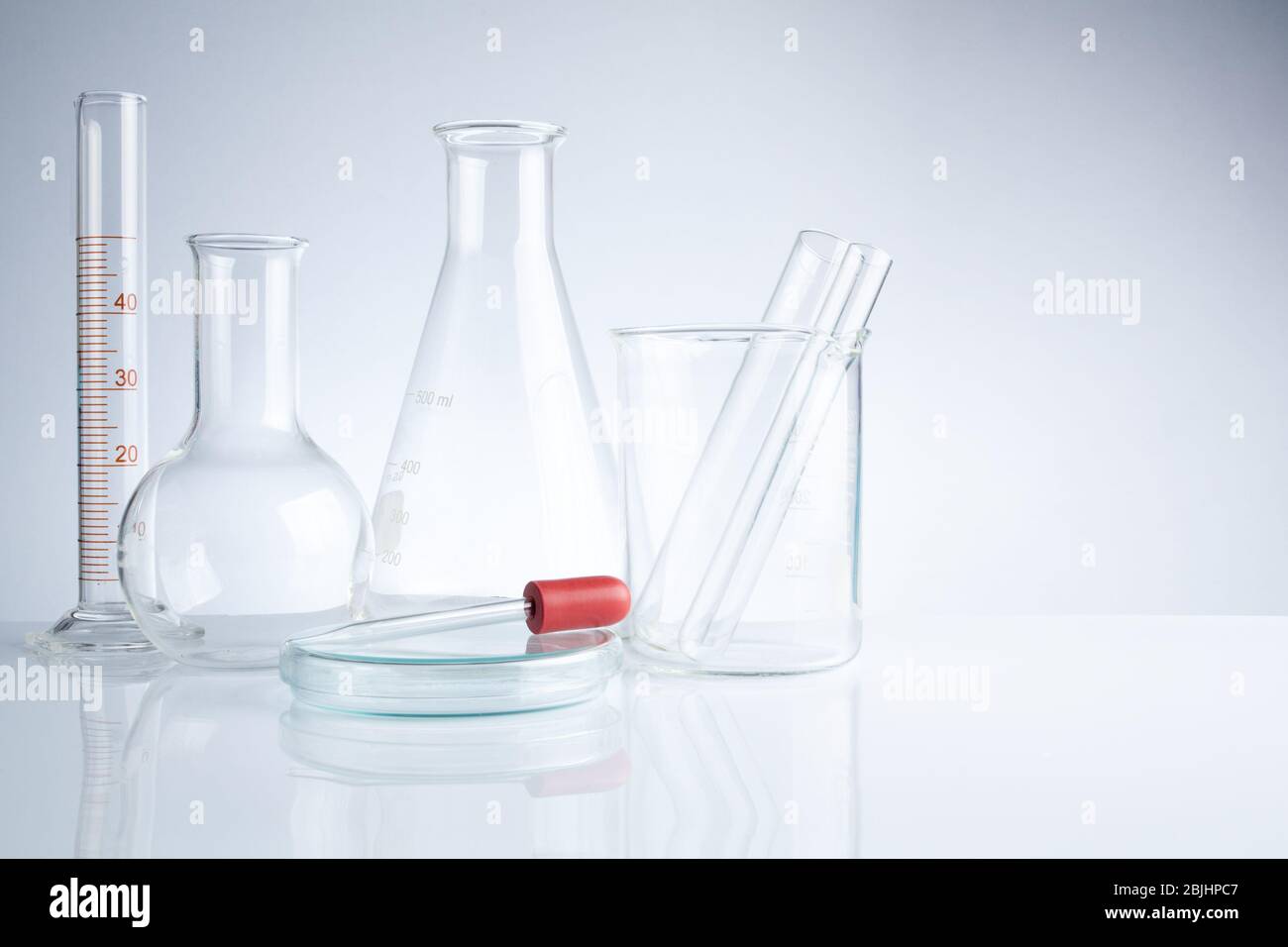 Group of laboratory glassware on table, Symbolic of science research ...