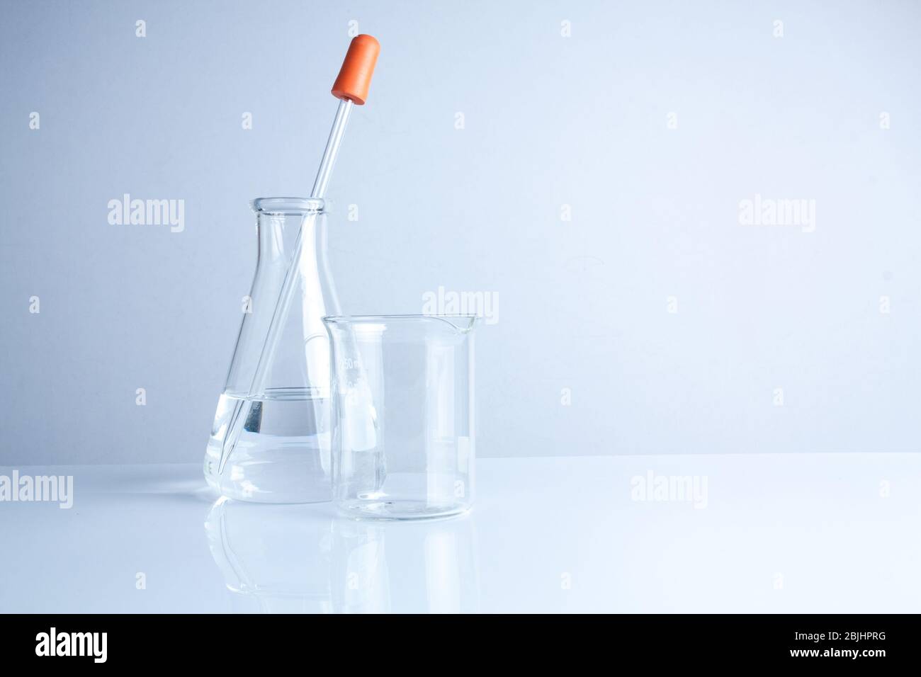 Group of laboratory glassware on table, Symbolic of science research ...