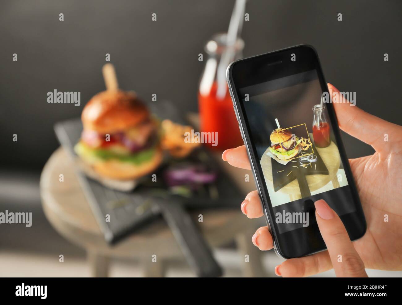 Female hands taking photo of food with mobile phone Stock Photo - Alamy